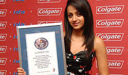 Trisha with Guinness World Records certificate for Colgate Pictures | nowrunning
